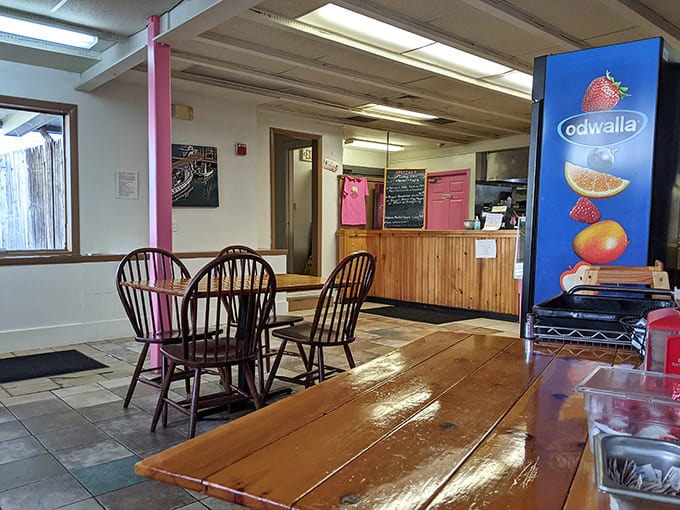 Simple wooden tables and local art create the perfect spot to demolish a cinnamon roll without judgment from anyone.