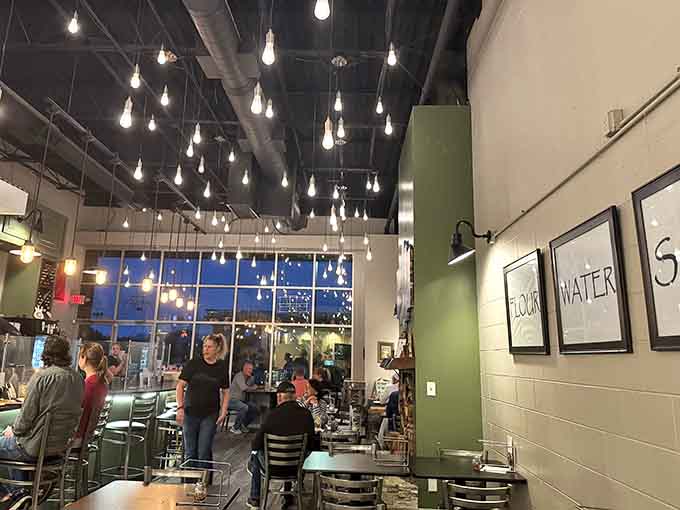 String lights and good vibes create the perfect setting for pizza that's about to blow your mind, one cheesy bite at a time.