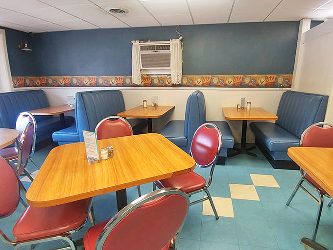 Interior: Blue vinyl booths and wooden tables create that perfect diner atmosphere &ndash; like stepping into a comfort food time machine.