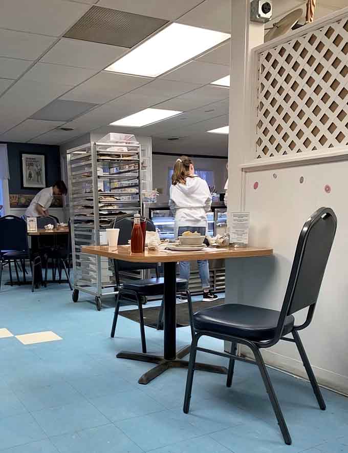 Simple booths and honest decor let the real star shine: the incredible food coming from that busy kitchen.