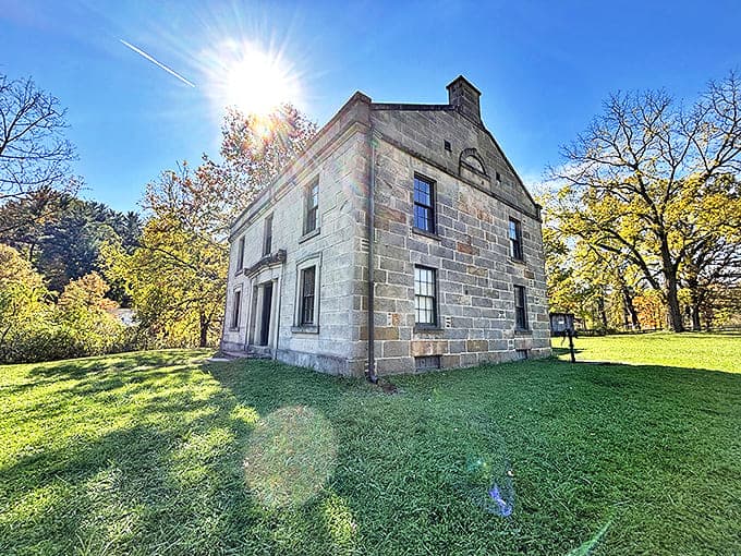 This imposing stone house looks like it's auditioning for a historical drama, its sturdy walls having witnessed nearly two centuries of Ohio history without needing a single HGTV renovation.