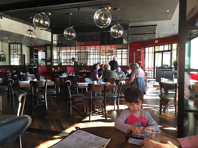 Modern meets cozy in this dining room where globe lights hang like culinary disco balls above happy diners.