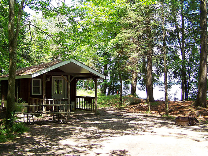 Rustic lakeside cabins offer that perfect blend of wilderness and comfort – like camping with training wheels and a better mattress.