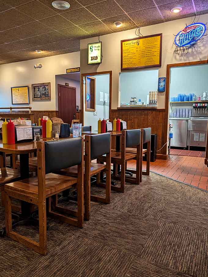 Step inside and find yourself in a space where wood paneling and comfortable booths create the perfect backdrop for serious burger consumption and root beer appreciation.