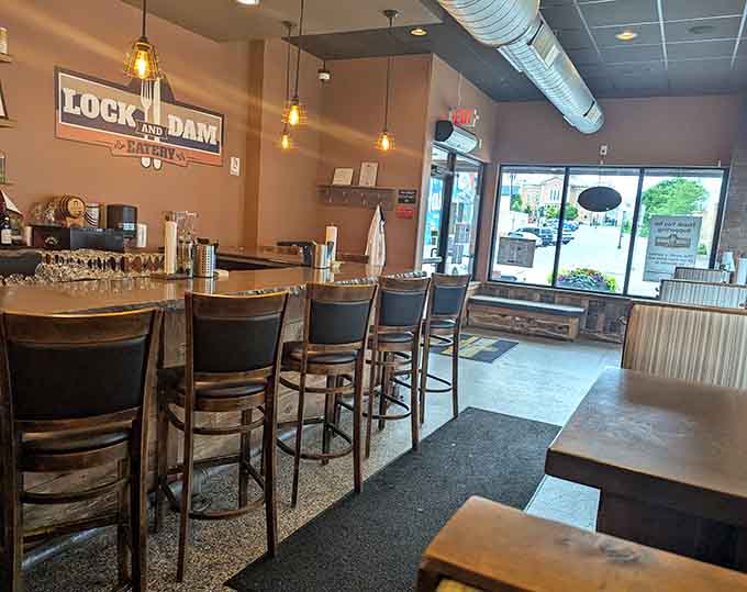 Modern industrial meets cozy comfort in this inviting space where exposed ductwork and warm lighting create the perfect fajita-eating atmosphere.