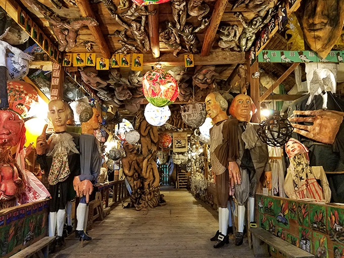 The main hall stretches like a surreal gallery, with historical figures and fantastical creatures creating a papier-m&acirc;ch&eacute; parliament of artistic rebellion.