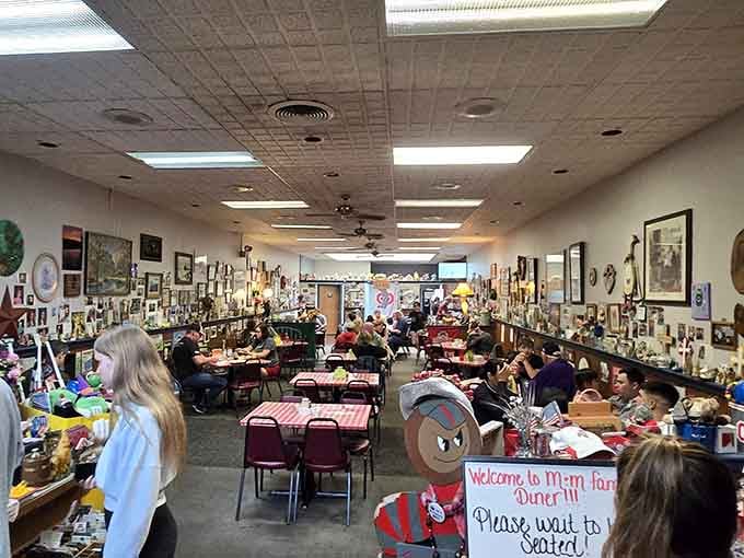 Every inch of wall space tells a story, making this dining room feel like eating inside a beloved family scrapbook.