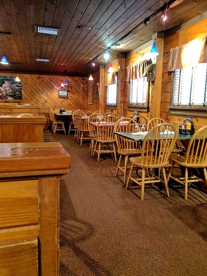 Wood-paneled walls and cozy seating create the perfect backdrop for serious eating, no fancy tablecloths required here.