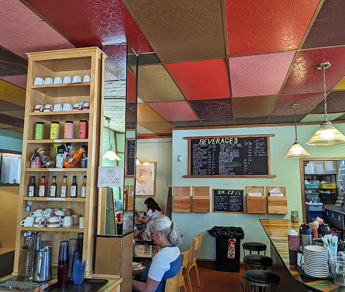 Step inside and let that kaleidoscope ceiling transport you to a dimension where every color gets along beautifully and breakfast is always the answer.