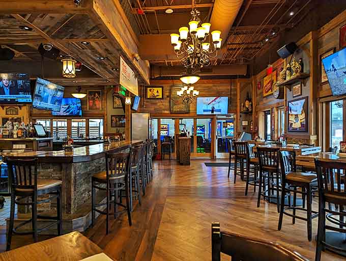 Rustic wood meets modern sports bar vibes, creating the perfect backdrop for serious pizza consumption and casual conversation.