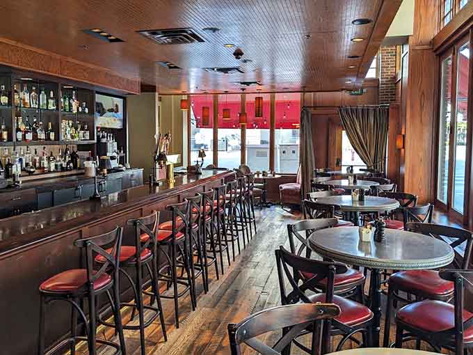 Wood tones and warm lighting create an atmosphere where both first dates and fiftieth anniversaries feel equally at home.