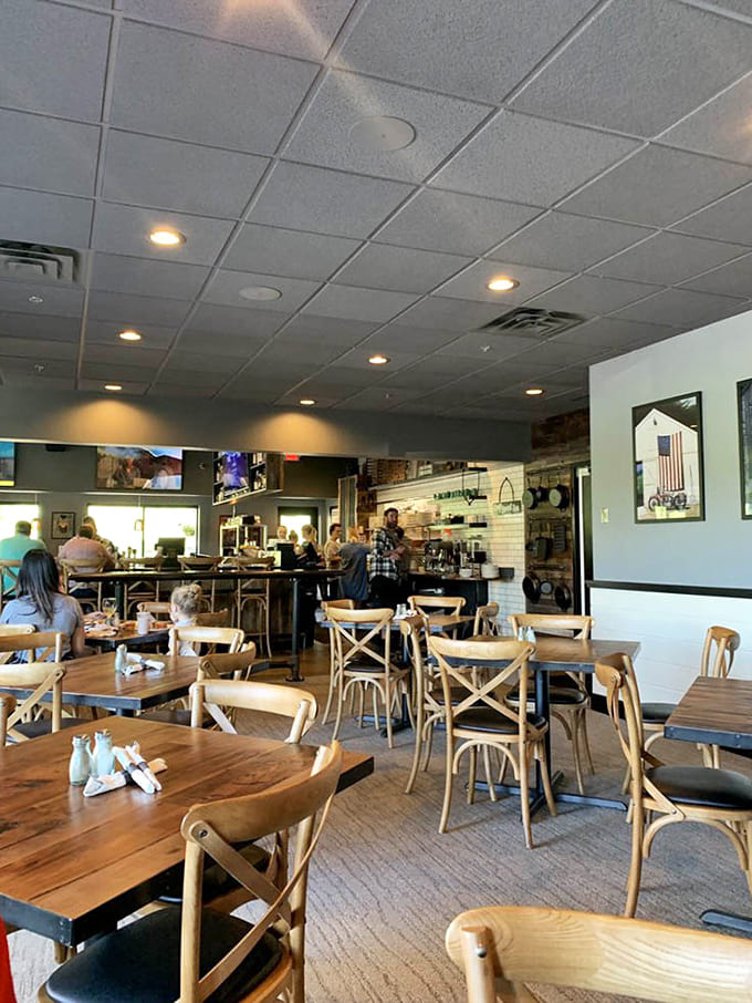 Inside, warm wood tones and farmhouse touches create an inviting space where strangers become friends over exceptional food.