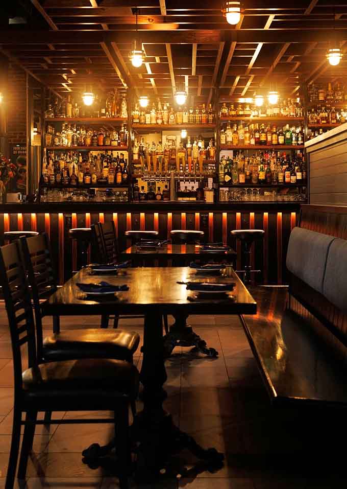 Inside Nosh, warm lighting and thoughtful design create an atmosphere where both first dates and anniversary dinners feel equally at home without trying too hard.