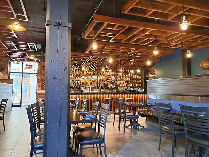 Industrial meets intimate in this thoughtfully designed space where exposed beams and warm lighting set the stage for memorable meals.