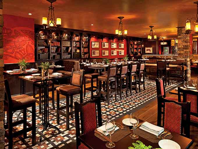 Inside Paddy's, rich wood tones and cozy lighting create an atmosphere where strangers become friends over perfectly poured pints and hearty plates.