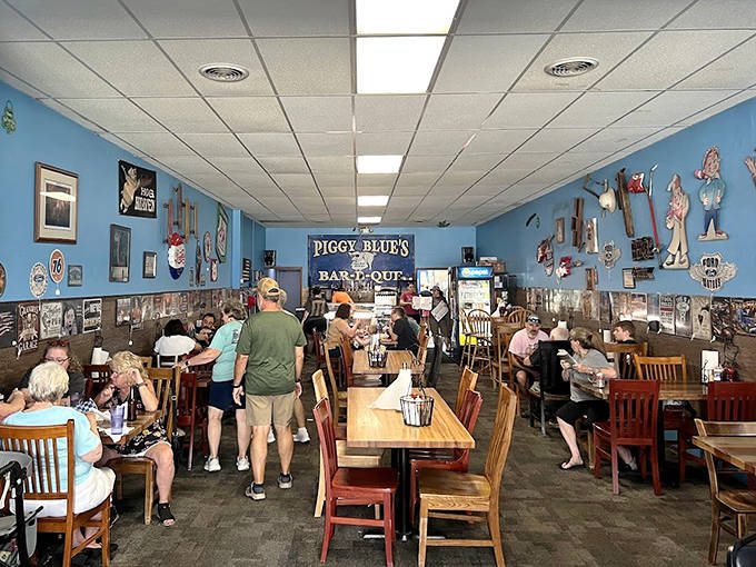 Inside Piggy Blue's, the lively blue walls and wooden tables create a homey atmosphere where barbecue dreams and friendly conversation flow freely.