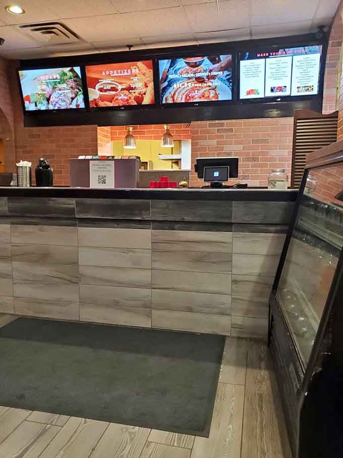 Clean lines and modern touches create a space where comfort food meets contemporary style, no checkered tablecloths required here.