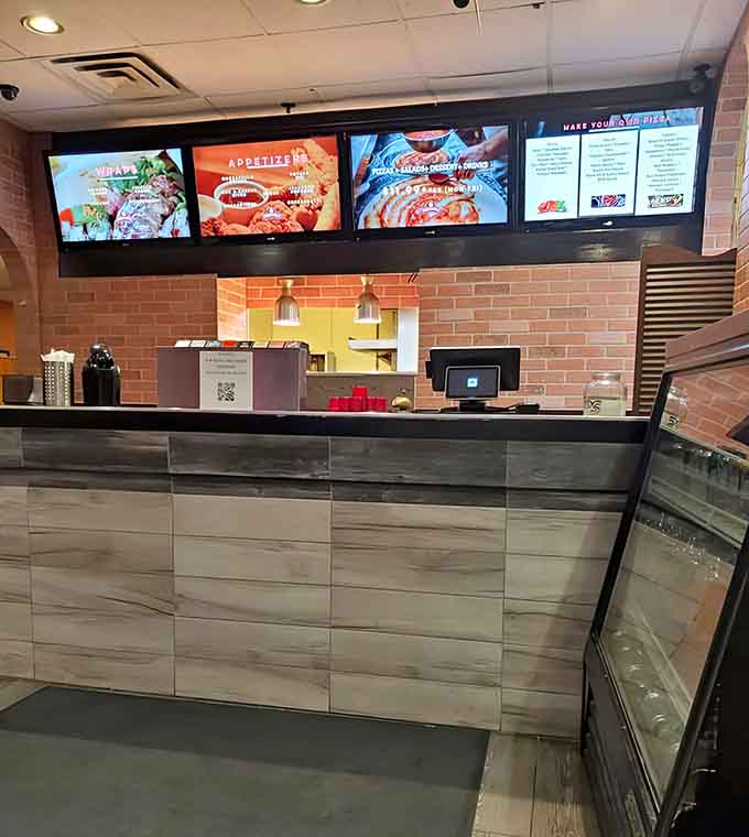 Orange and green booths create a retro vibe that's more "comfortable classic" than "trying too hard to be vintage."