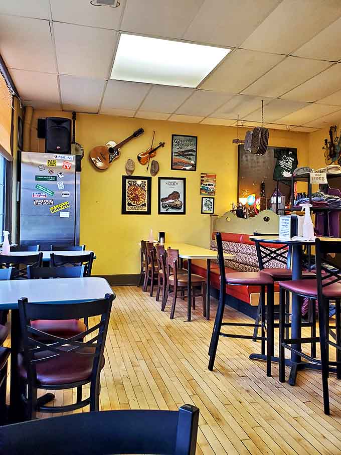 Warm yellow walls adorned with musical instruments create the perfect backdrop for comfort food conversations and pre-concert anticipation.
