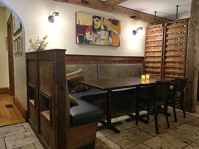 Rustic wood meets modern comfort in dining spaces designed for lingering over exceptional meals.