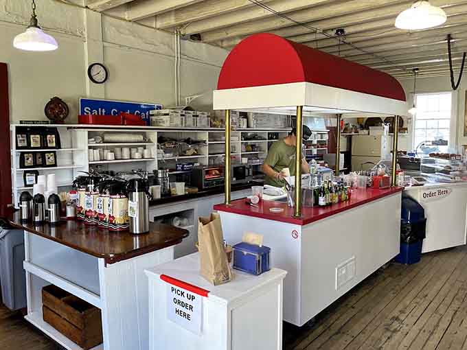Inside, the casual coastal charm meets practical cafe efficiency, where ordering feels like visiting a friend's really well-organized kitchen.