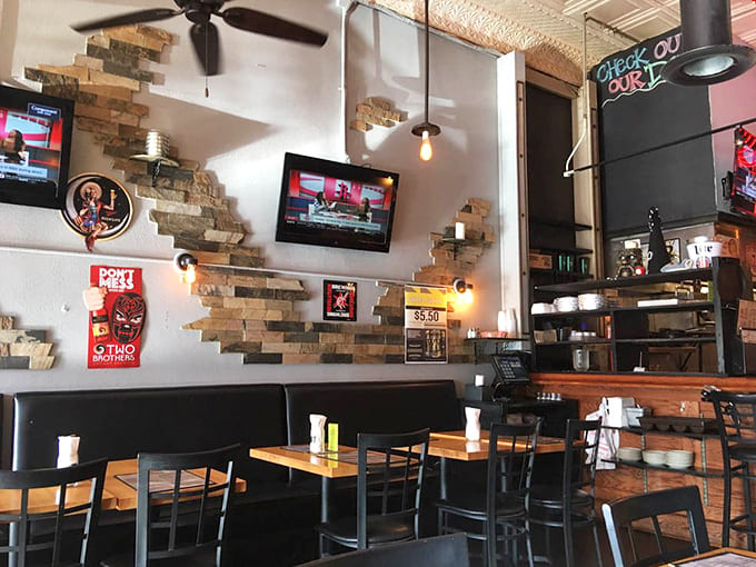 Inside, exposed brick and warm lighting create the perfect neighborhood hangout vibe where everyone feels like a regular from day one.