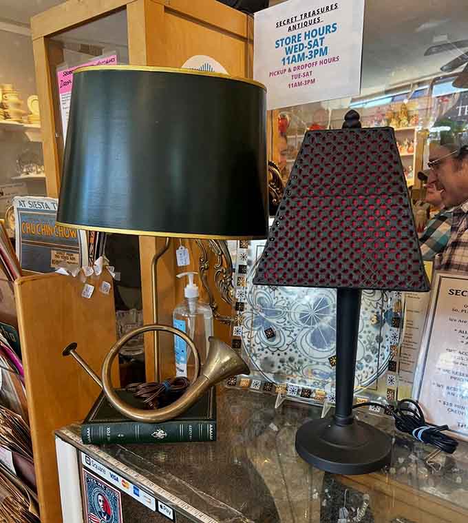 Vintage lamps create pools of warm light throughout the store, each one ready to illuminate someone's reading nook or bedside table.