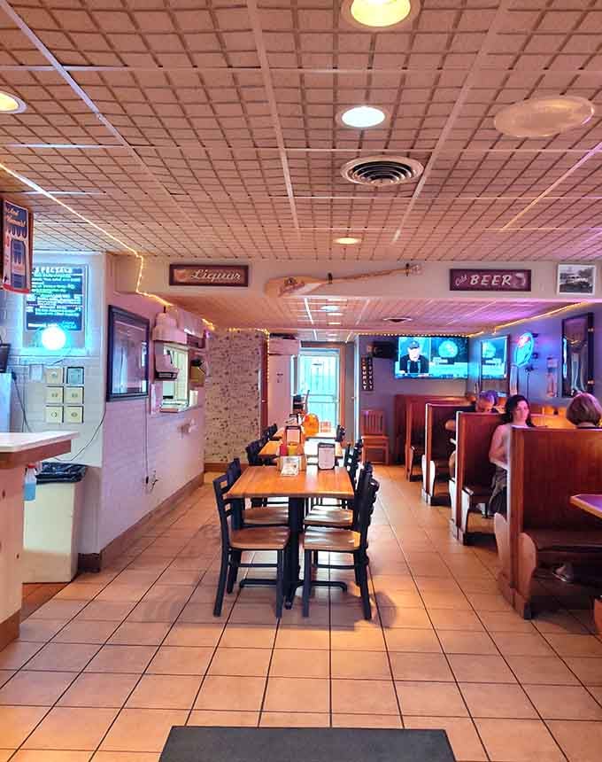 Step inside to find a cozy time capsule where string lights and wood paneling create the perfect neighborhood bar vibe.