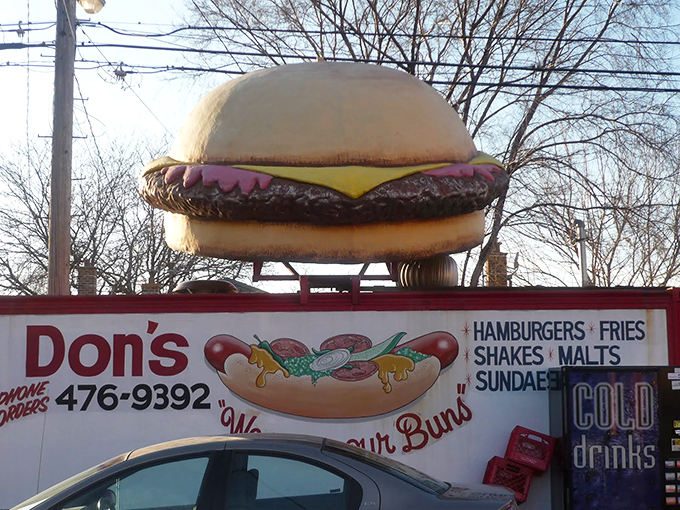 Talk about a meaty welcome! This giant burger sign is Don's way of saying, "Come on in, we've got what you're craving!" 