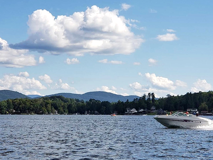 Speed demons welcome! Boating enthusiasts can slice through crystal-clear waters while mountains stand guard in the distance.