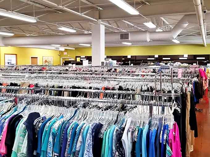 Endless racks of clothing stretch into the distance like a fashionista's fever dream, organized and ready for your treasure hunting pleasure.
