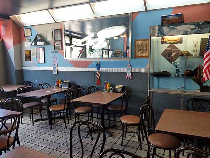 Inside, the retro vibe meets practical comfort, with tables ready to host everyone from solo diners to hungry families.