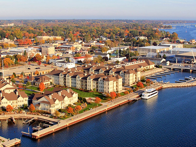 Waterfront buildings catch the golden hour light, transforming ordinary architecture into a painter's dream of warm hues and long shadows.