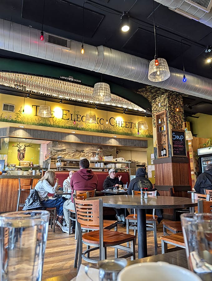 Warm wooden tables beneath basket pendant lights create the perfect backdrop for root beer revelry, while the signature Cheetah logo watches over diners.