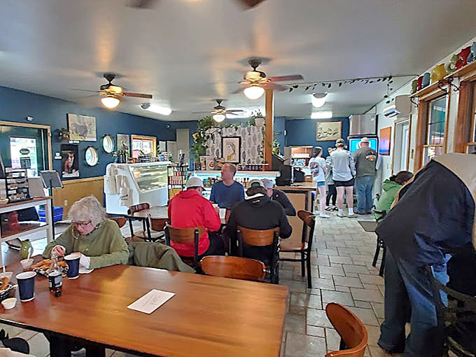 Inside, the laid-back vibe says "relax and enjoy," while those chalkboard menus whisper sweet promises of fried perfection and lakeside contentment.