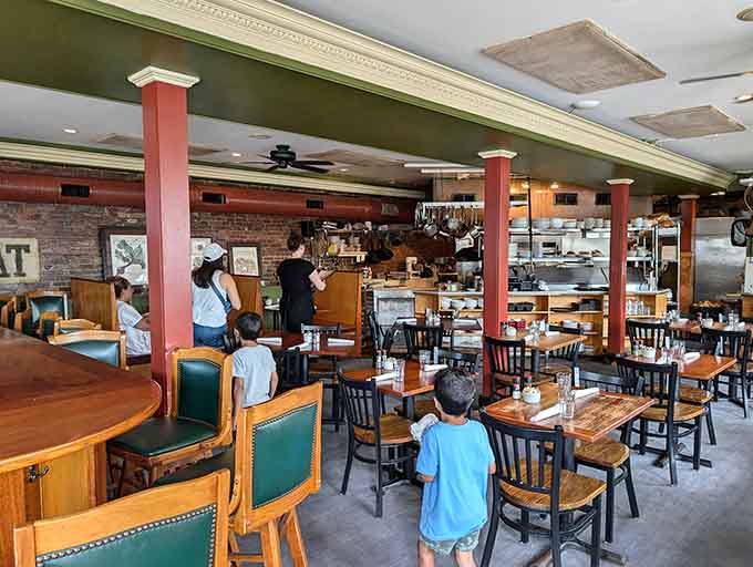 Inside, exposed brick and warm wood create the kind of cozy atmosphere where time slows down deliciously.