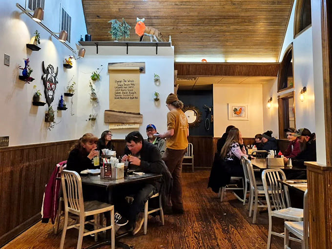Warm wood tones and whimsical decor create a space where conversations flow as freely as the delicious food from the kitchen.