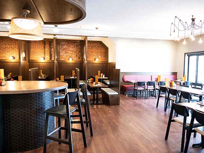 Exposed brick, cozy booths, and warm lighting create the perfect backdrop for serious sandwich consumption and good conversation.