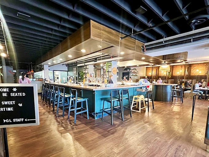 Inside, the modern yet cozy space invites you to settle in and stay awhile at the welcoming bar.