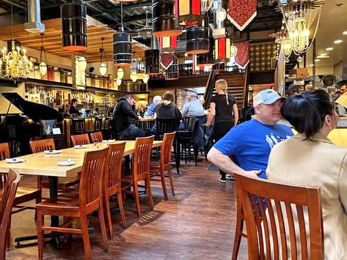 Chandeliers and warm wood create an atmosphere where both first dates and family dinners feel perfectly at home.