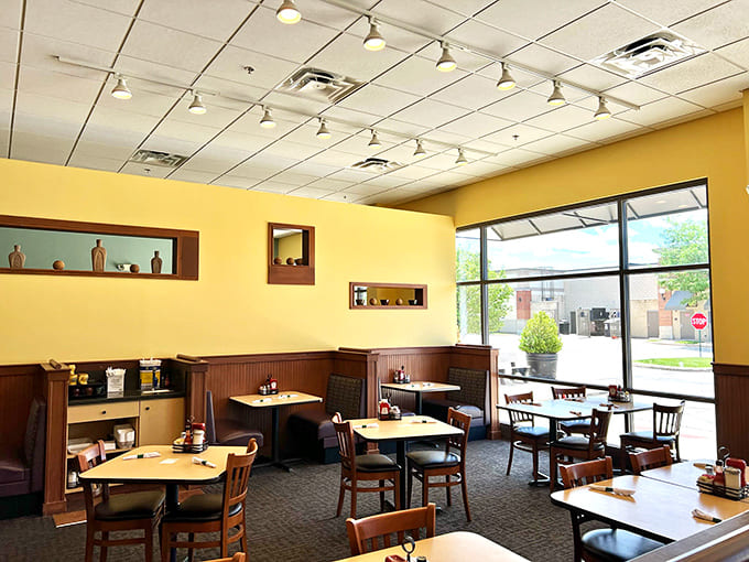 Sunny yellow walls and cozy seating create the perfect atmosphere for savoring autumn's finest pancake creation.