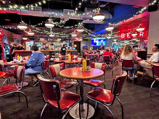 Step inside and the retro magic hits you immediately, with red vinyl booths and twinkling lights creating an atmosphere that's pure nostalgic joy without the scratchy records.