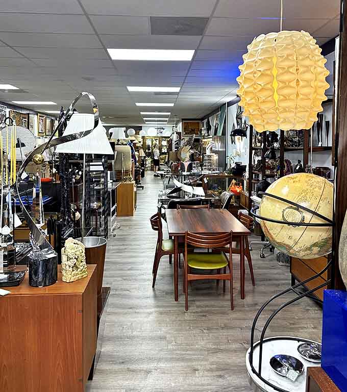 A wonderland of mid-century modern furniture stretches before you, each piece telling its own story from decades past.