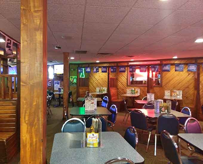 Step inside to discover a welcoming space where wood paneling and cozy booths create the perfect neighborhood gathering spot.