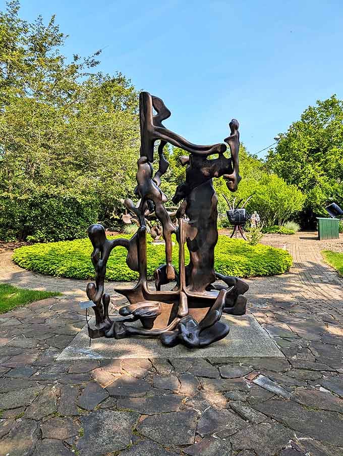 Abstract bronze figures dance in perpetual motion, their fluid forms telling stories that change with each viewing angle.