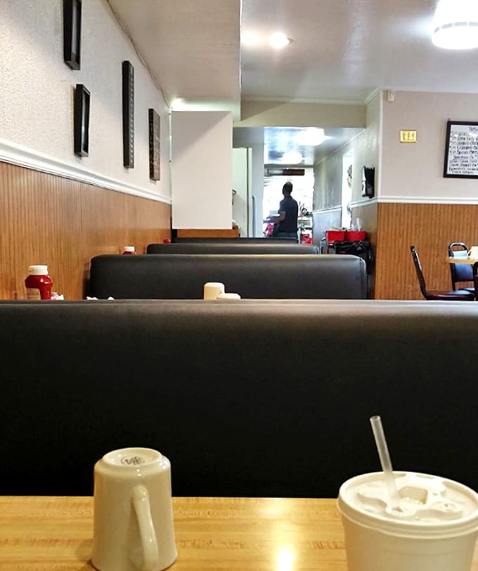 Classic diner vibes with wood-paneled walls and comfortable booths create the perfect backdrop for conversations that flow as freely as the coffee.