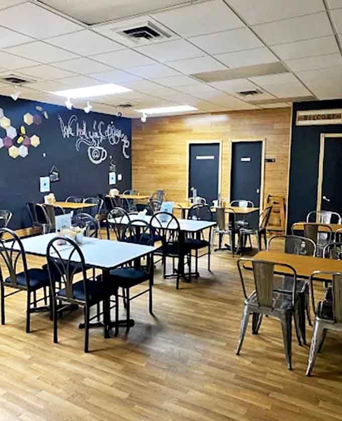 Interior: Modern meets cozy in this thoughtfully designed space, where wooden floors and stylish seating create the perfect backdrop for waffle-induced happiness.