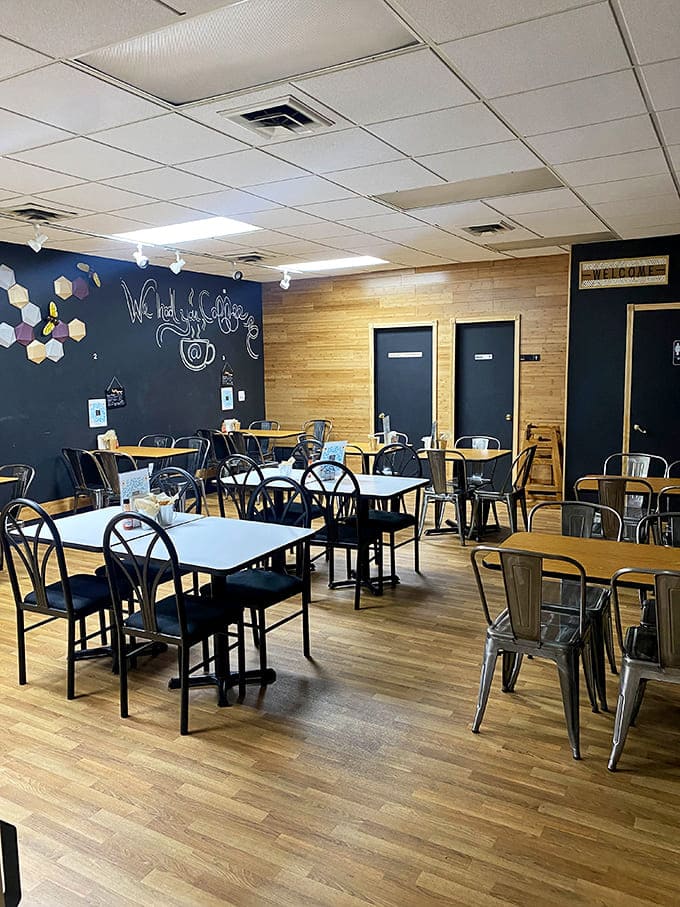 Modern meets cozy in this welcoming space where wood tones and metal chairs create the perfect backdrop for serious waffle consumption.