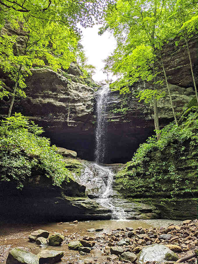 Water cascades dramatically over ancient rock faces, creating nature's version of a spa treatment. The mist alone is worth the hike!