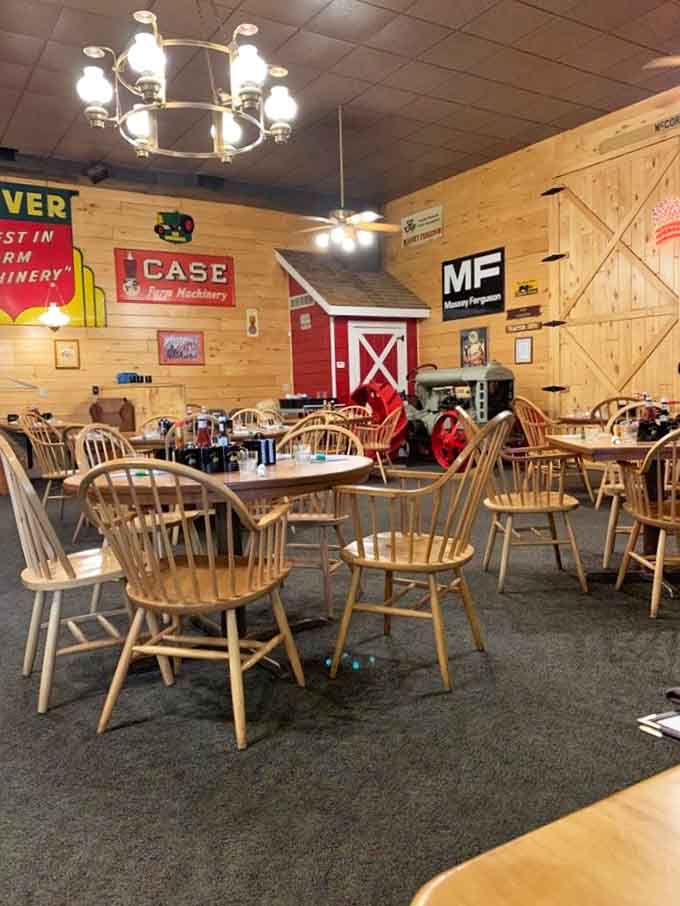 Vintage farm signs and wooden beams create an atmosphere that's part agricultural museum, part cozy dining room, all charm.